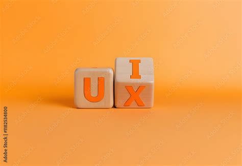 Ilustración De Stock Ux Ui Concept Wooden Blocks Spelling Out Ux Ui On An Orange Background