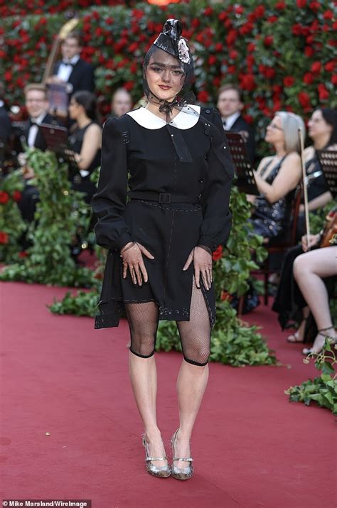 Maisie Williams Puts On A Leggy Display In A Textured White Minidress As She Sits Front Row At