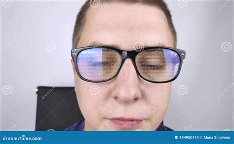The Programmer`s Glasses Reflect Moving Lines Of Code Programming