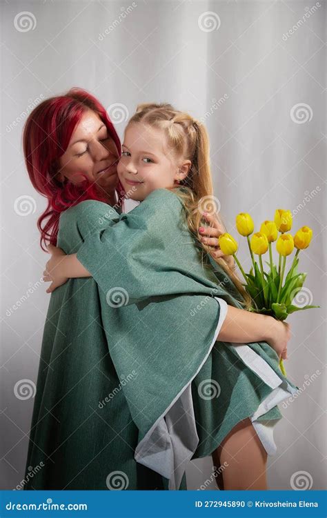 Amazing Pretty Mother And Daughter Having Fun With Flowers In 8 March Or In Motherand X27 S Day