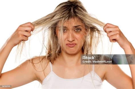 Desperate Blond Woman With Messy Wet Hair On White Background Stock