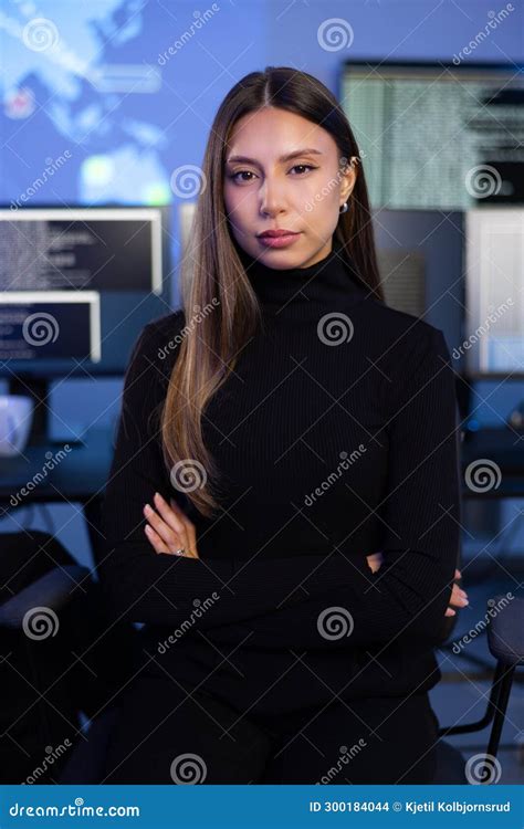 Confident Female Cybersecurity Analyst Or Manager In Large Cyber Security Operations Center SOC