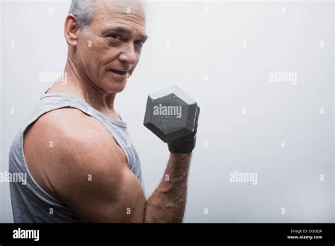 Senior Man Lifting Dumbbell Portrait Stock Photo Alamy