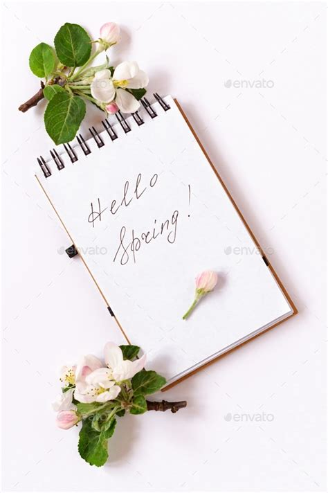 Hello Spring Notebook Page With Handwritten Text And Spring Apple Blossoms Top Vertical View