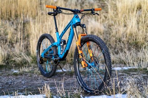 Blue And Orange Bike On Snow Covered Road