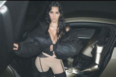 Kim Kardashian Cozies Up With Tesla Robot In Controversial Posts