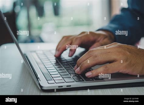Man Using Computer Laptop Searching Internet Sending Sms Using Text