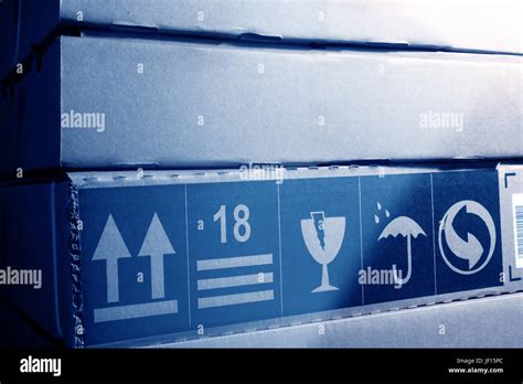 Close Up Warning Signs On Cardboard Package Stock Photo Alamy