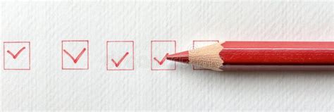 Red Pencil Marking A Checkbox On Ballot Paper During An Election Red Pencil Marking A Checkbox On Ballot Paper During An Election
