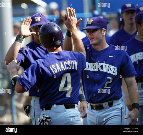 University Of Washington Runner Greg Isaacson 4 Is Greeted By Teammate Ben Johnson 2 After