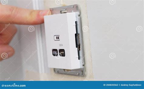 Installation Of A USB Type C Socket At The Head Of The Bed For Charging Devices Stock Photo