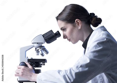 Woman Using A Microscope In The Lab Stock Photo Adobe Stock