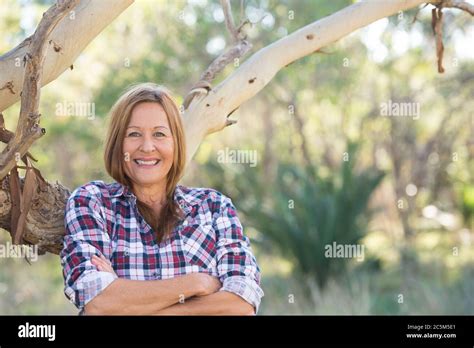 Portrait Attractive Mature Woman In Rural Country Wearing Plaid Shirt