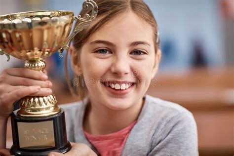 I Came Tops In My Class Portrait Of An Elementary School Girl Holding A Trophy In Class Stock