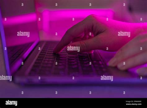 Person Typing At Laptop Computer At Night Female Uses Keyboard Shakes