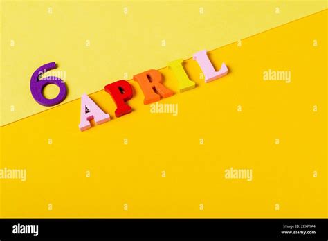 Wooden Letters Of The Sixth Of April On A Yellow Background