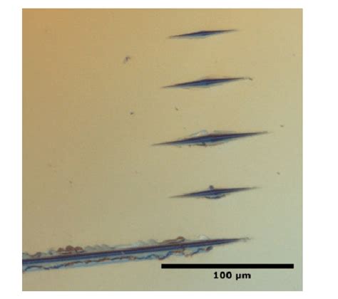 Image Of An Array Of Indents And Scribe Mark Taken With The Mitutouo