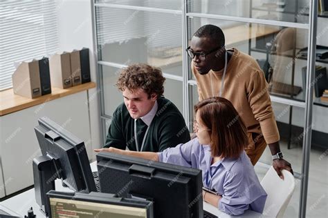 Premium Photo Team Of Programmers Working On Computers