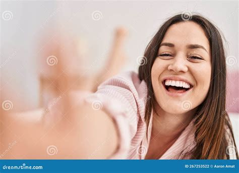 Young Woman Make Selfie By The Camera Lying On Bed At Bedroom Stock