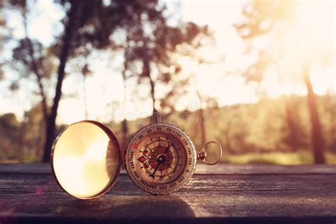 A Compass Over Wooden Table At Sunset Light Stock Image Image Of