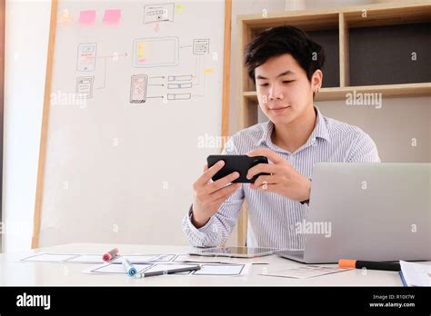 Programer Working Development Software With Ux Ui Project In Paper Pre Project And Smartphone