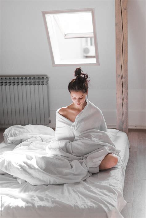 Portrait Of Beautiful Woman Who Sitting On Bed By Stocksy Contributor