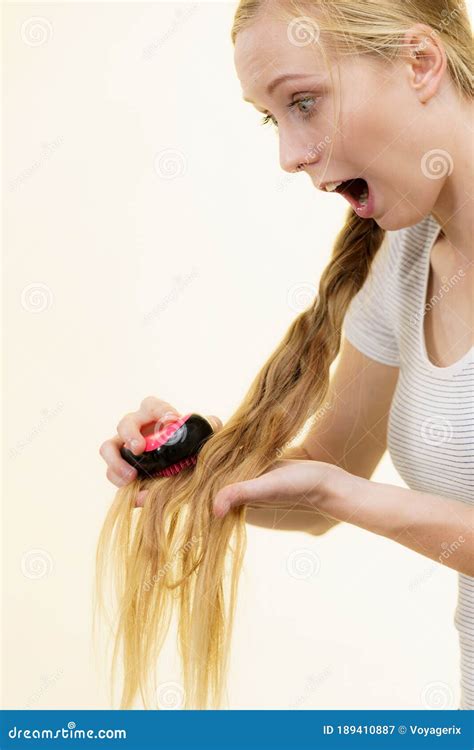 Blonde Girl Brushing Her Long Hair Stock Image Image Of Hair Conditioner 189410887