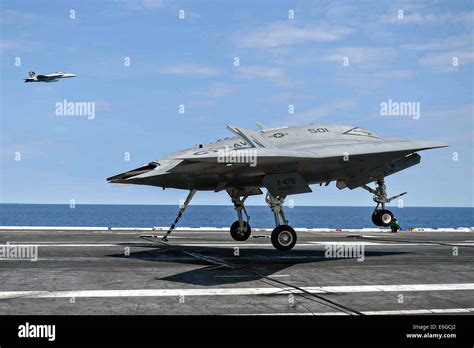 The Us Navy X 47b Autonomous Stealth Unmanned Aerial Vehicle Performs An Arrested Landing On The