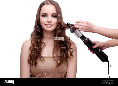 Beautiful Woman Getting Her Hair Done With Hair Dryer Isolated On White
