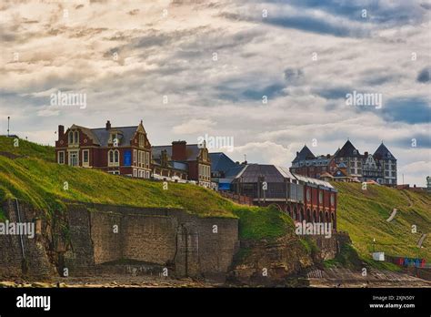A Scenic View Of Historic Buildings On A Cliffside Overlooking The