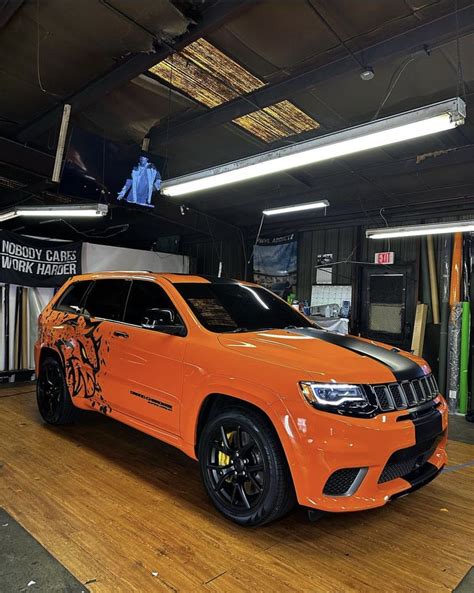 Orange Trackhawk Luxury Suv