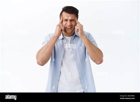 Healthcare People And Emotions Concept Portrait Of Handsome Adult Man Squinting And Grimacing