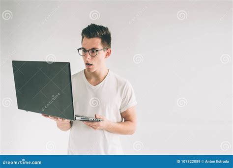 Man Holding Laptop Computer Isolated On Gray Nerd Is Wearing Glasses Stock Image Image Of
