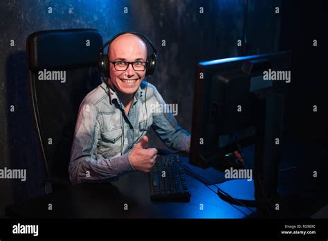 Adult Gamer Sits At Home With A Computer Shows A Thumbs Up And Looks Into The Camera A Man