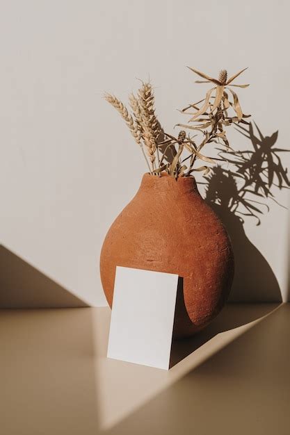 Premium Photo Blank Paper Sheet Card With Copy Space And Clay Pot