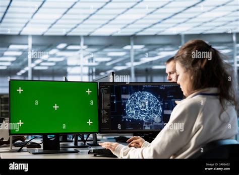 Woman In Ai Data Center Coding On Green Screen Computers Upgrading Equipment It Engineers At