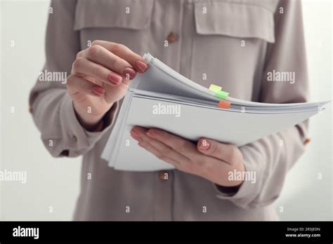Woman Stacking Documents On White Background Closeup Stock Photo Alamy
