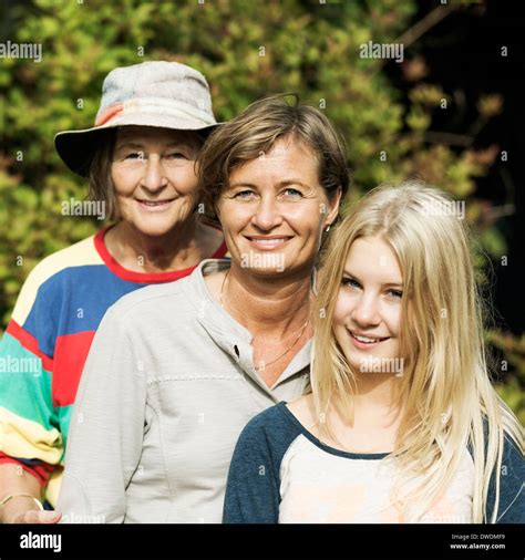 Portrait Of Happy Three Generation Females At Yard Stock Photo Alamy