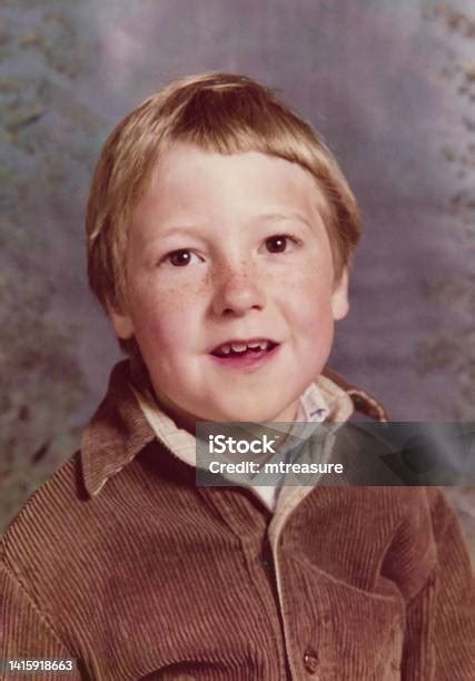 Closeup Image Of Young Shorthaired Blonde Boy With Brown Eyes And