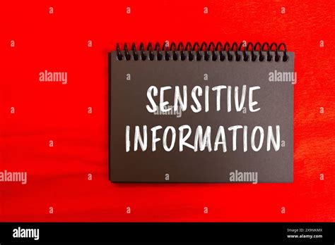 Sensitive Information Message Written On Black Notebook Page With Red Background Conceptual