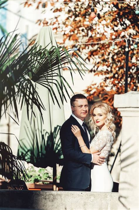 Bride And Groom Close Up Portrait Of A Man In A Suit And A Woman With