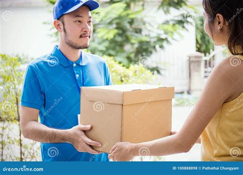Woman Accepting Receive A Delivery Of Boxes From Delivery Asian Man Stock Photo Image Of