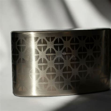 Rectangular Metal Container With Rounded Edges Featuring Geometric