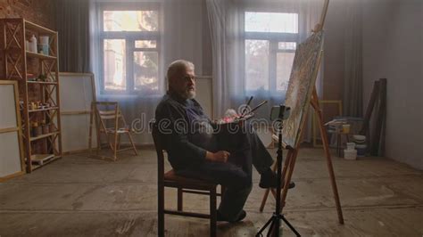 Elder Man Spending His Free Time With Hobby Visiting Art Studio Class