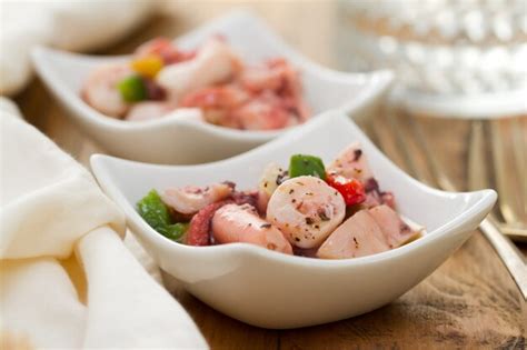Premium Photo Salad With Octopus In Bowl On Brown Wooden