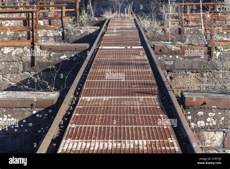 Rusted Metal Walkway In An Industrial Setting With Grid Pattern Stock Photo Alamy