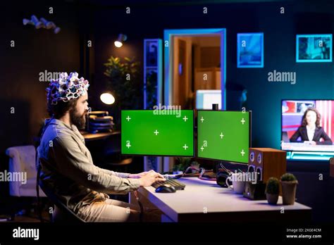Software Engineer With Eeg Headset Starting Mind Upload On Isolated Screen Multi Monitor Setup