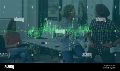 Image Of Data Processing Over Diverse Female And Male Colleagues