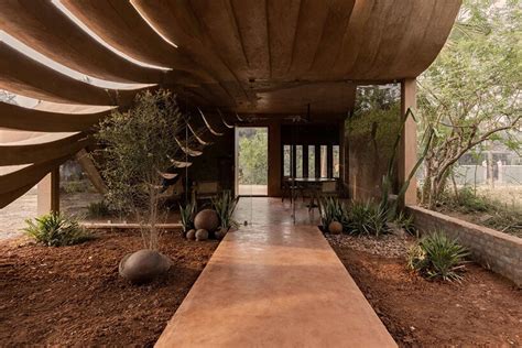 Perforated Curved Wall Acts As Climatic Buffer At Vy Architecture
