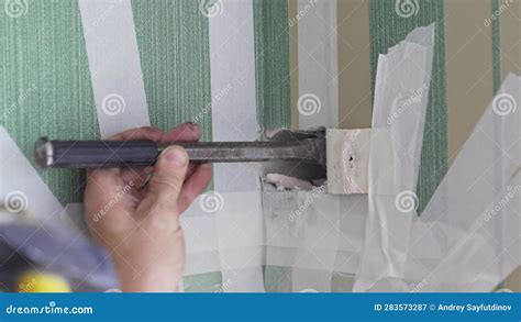 A Chisel And A Hammer Are Used To Lay The Route Of The Pipe And Wires Stock Video Video Of